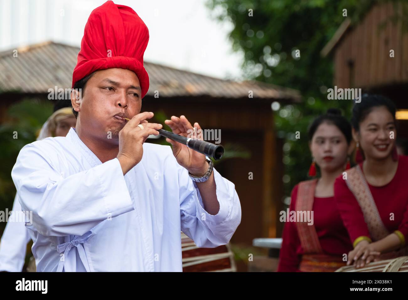 Asian man plays the flute. Vietnamese artists performing traditional ...