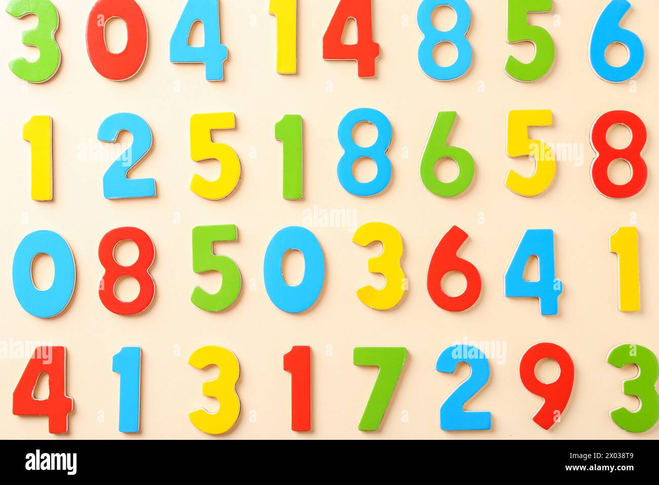 Colorful numbers on beige background, flat lay Stock Photo - Alamy