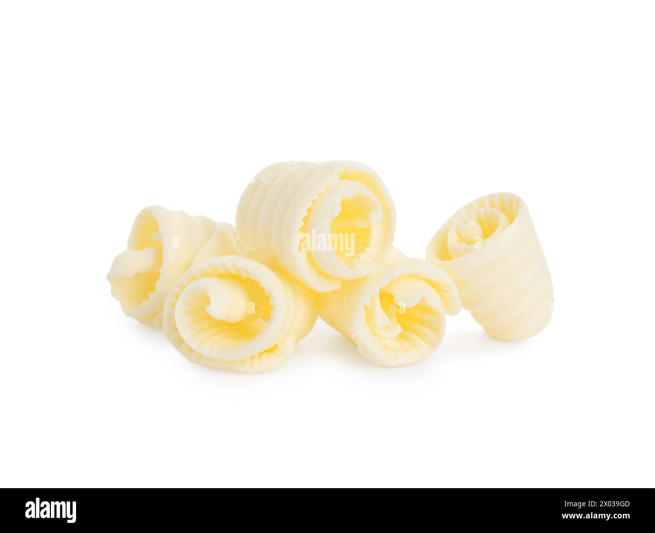 Pile of tasty butter curls isolated on white Stock Photo - Alamy