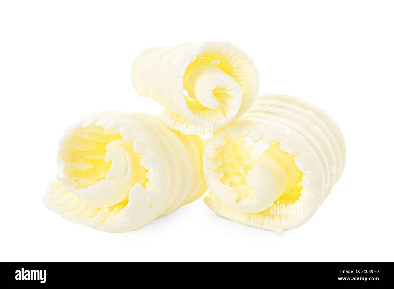 Three tasty butter curls isolated on white Stock Photo - Alamy