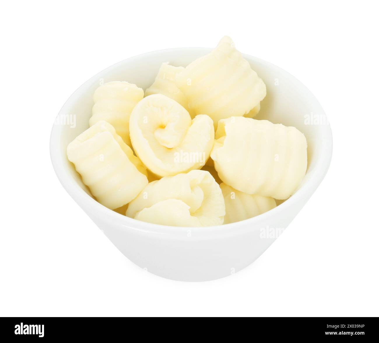 Tasty butter curls in bowl isolated on white Stock Photo - Alamy