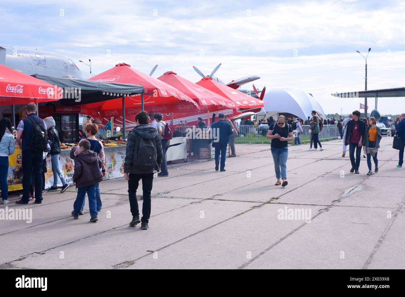 People visitors walking around during fest, tents stalls food court ...