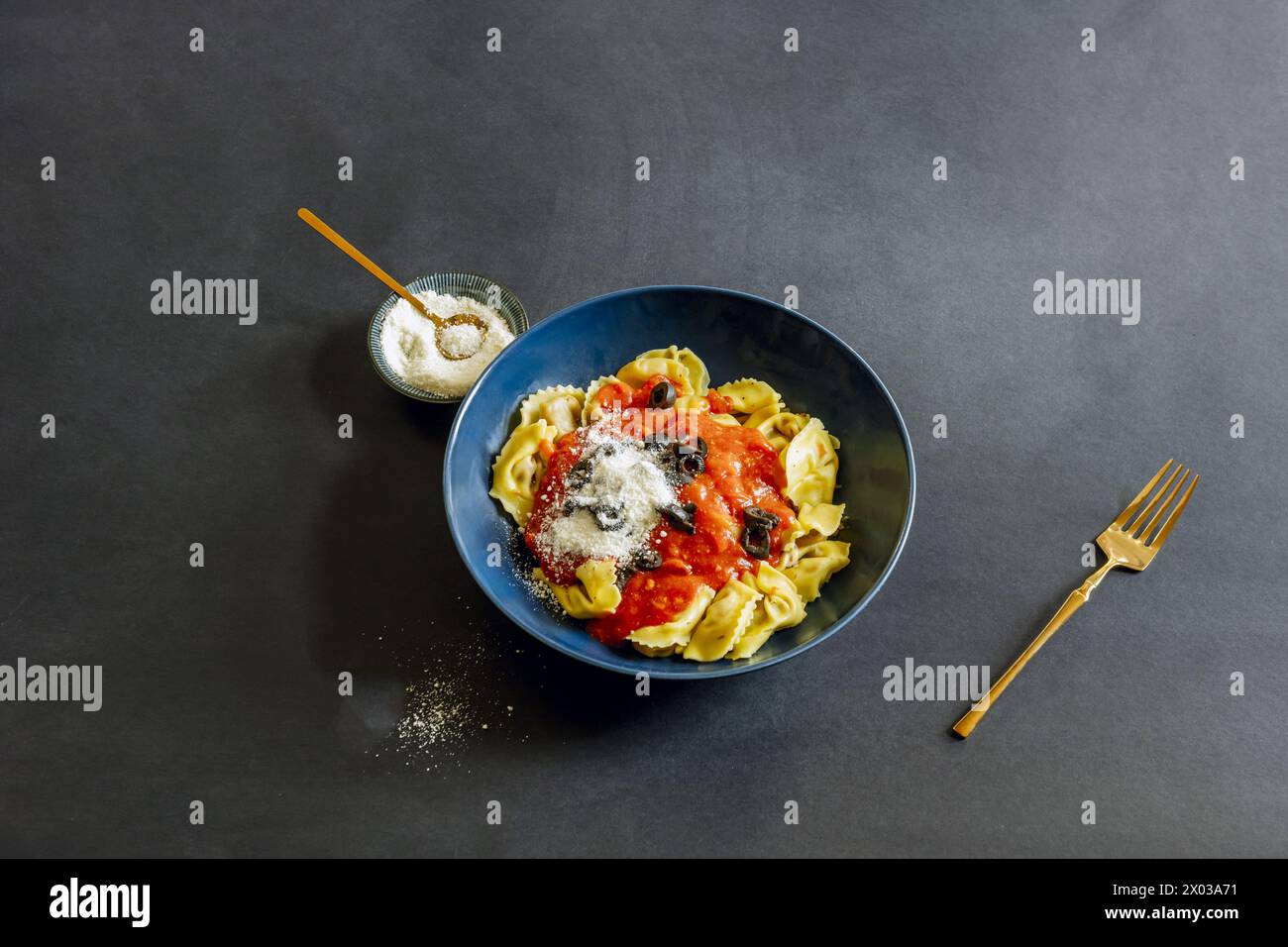 Photographing Italian pasta with tomato on a black surface Stock Photo ...