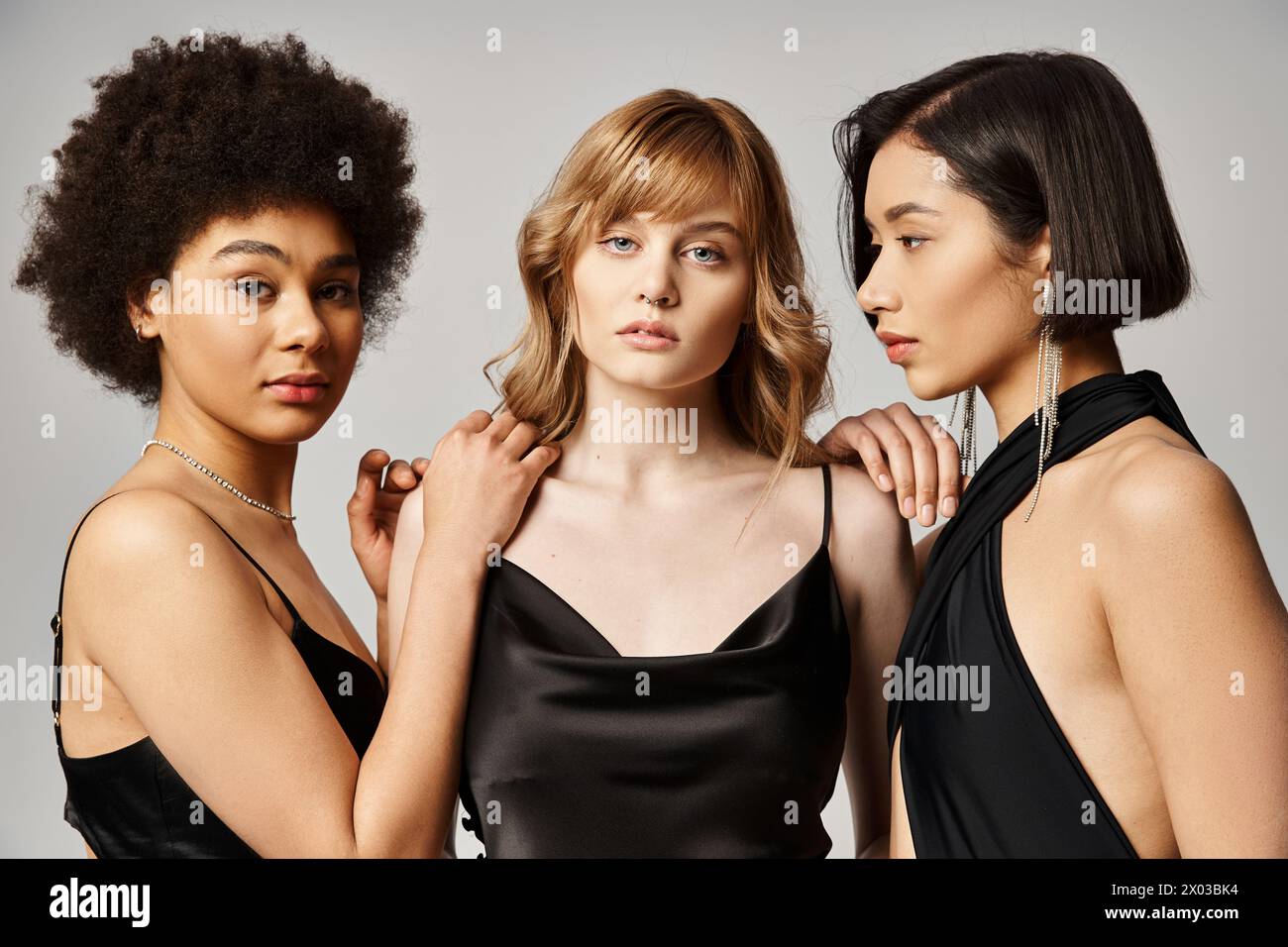 Three beautiful women of Caucasian, Asian, and African American descent ...