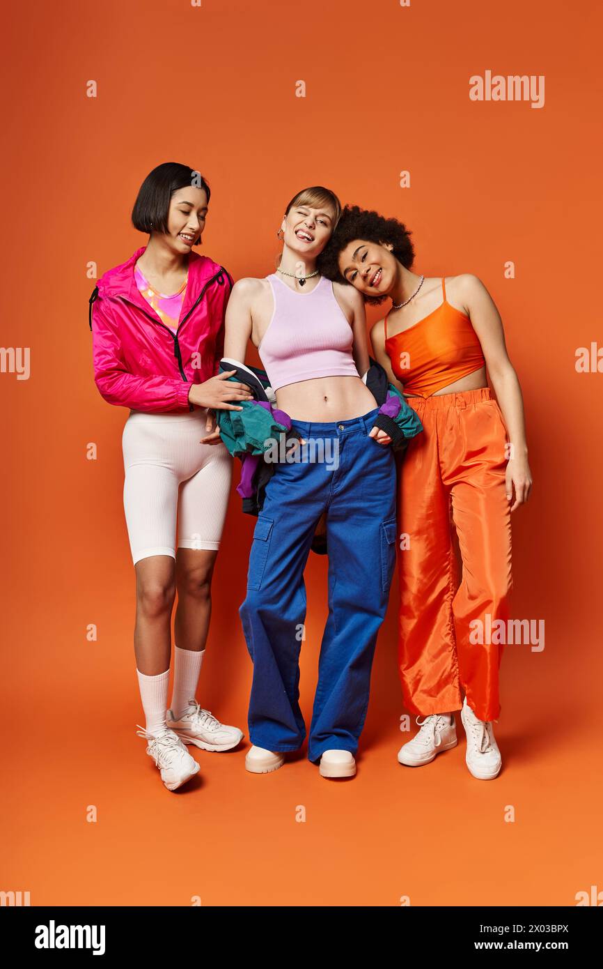 A group of multicultural young women standing together against an ...