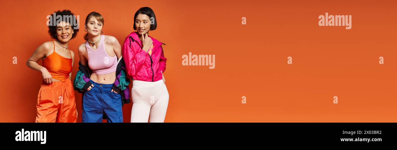 Three women, representing diversity, stand closely together in front of ...