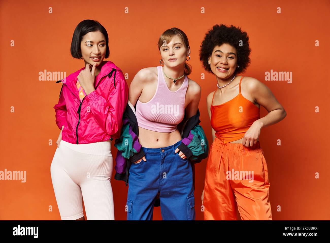 Three women of different ethnicities standing together, representing ...