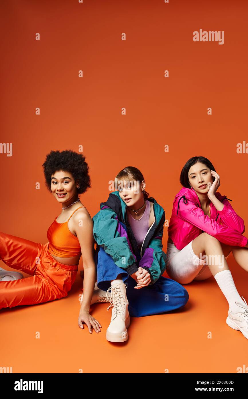 A diverse group of young women sit together, showcasing multicultural ...