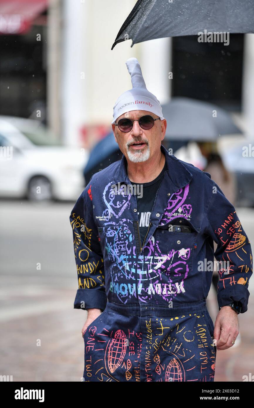 Howie Mandel wearing an interestingly shaped hat with the Modern Family ...