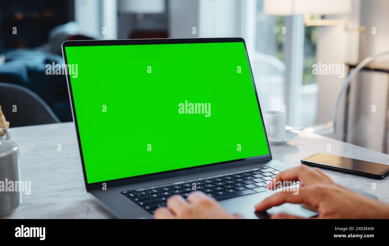 Green Screen Mock Up Display on a Laptop Computer. Close Up on Person's ...