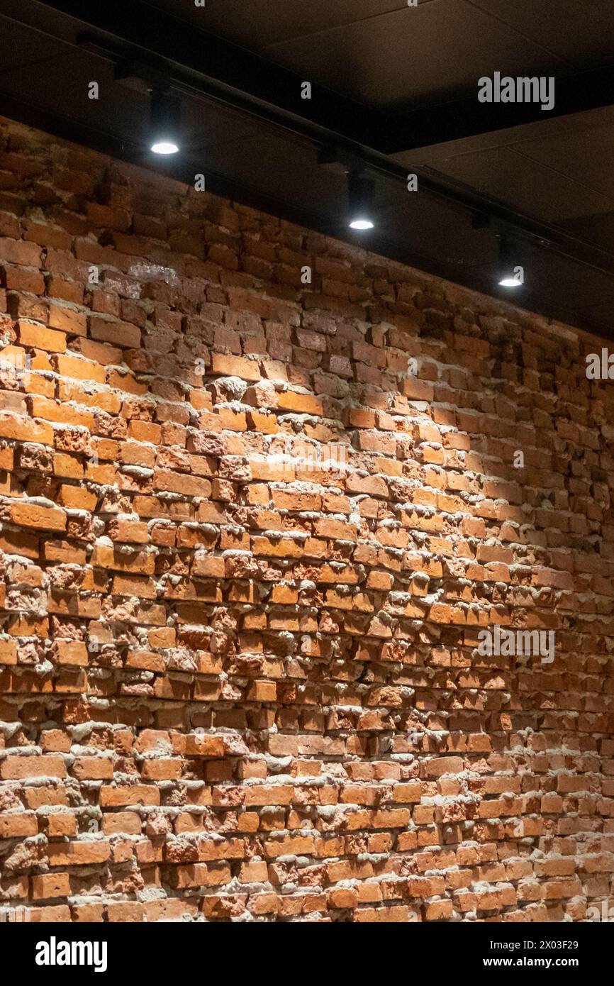 Brick wall with spotlight from the ceiling, highlight its texture Stock ...