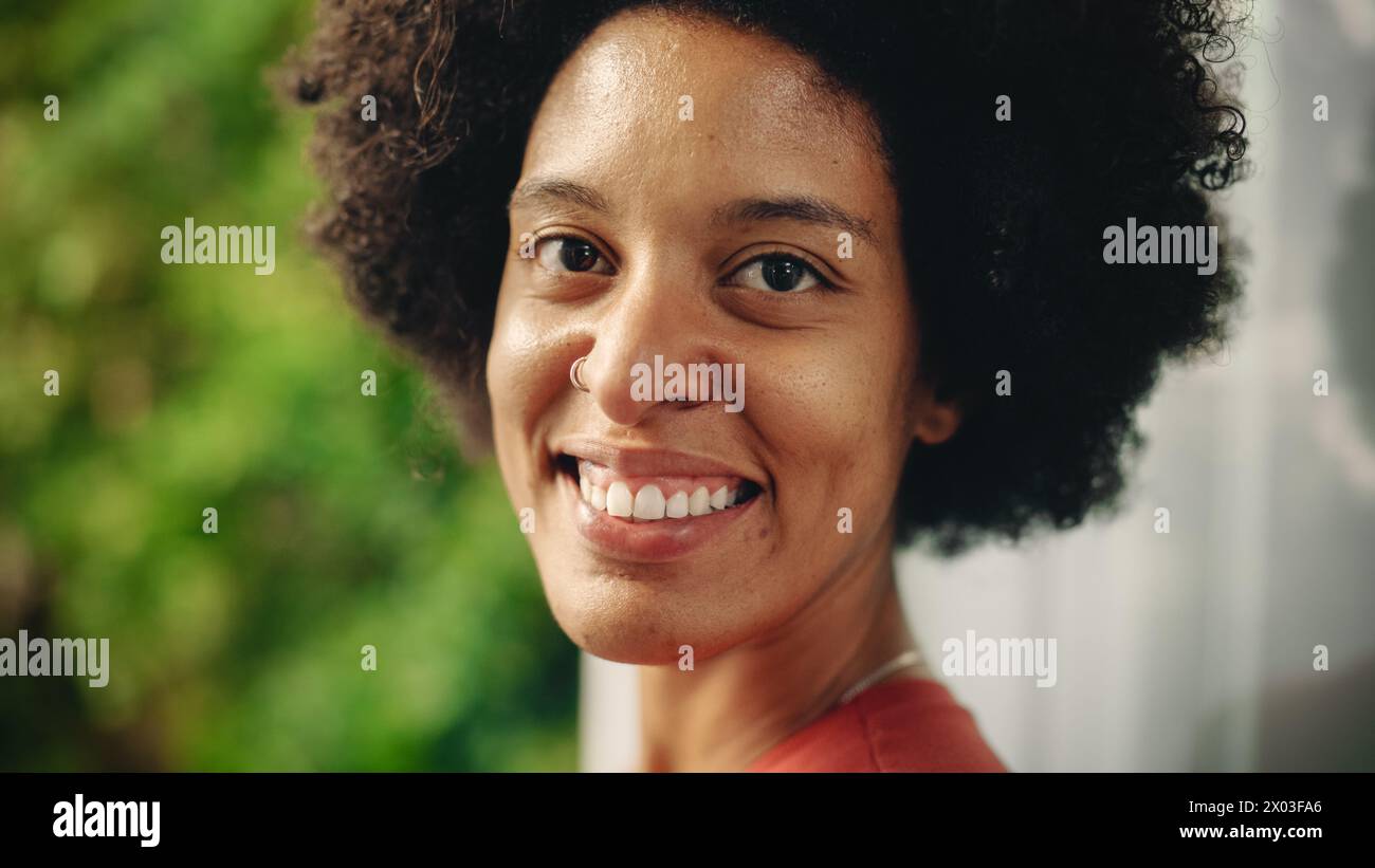 Close Up Portrait of a Happy Young Latina with Brown Eyes, Afro Hair ...