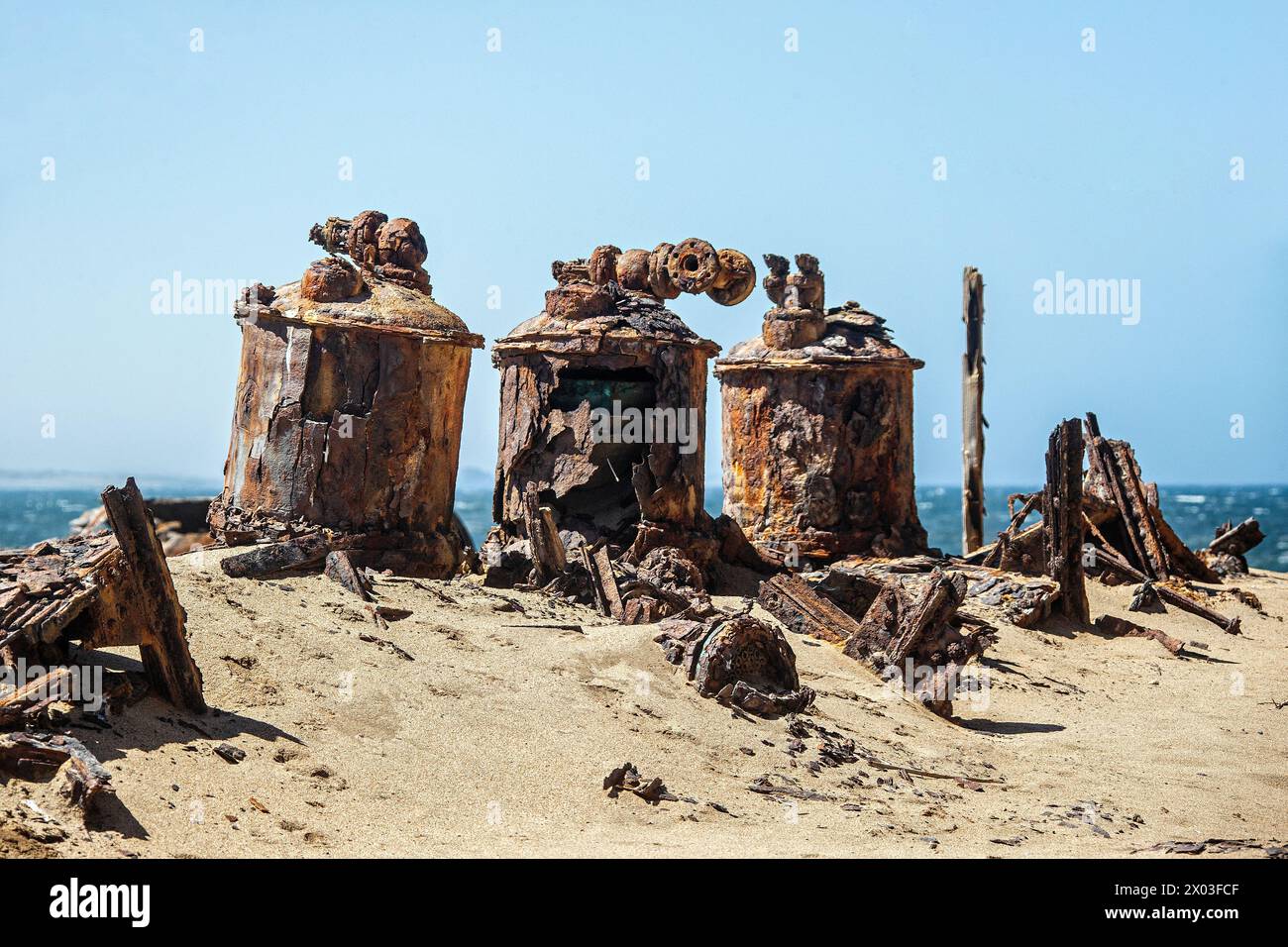 Rusted remains of the desalination plant by the Bogenfels Rock Arch in ...