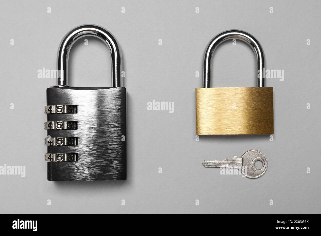 Different padlocks and key on grey background, top view Stock Photo - Alamy