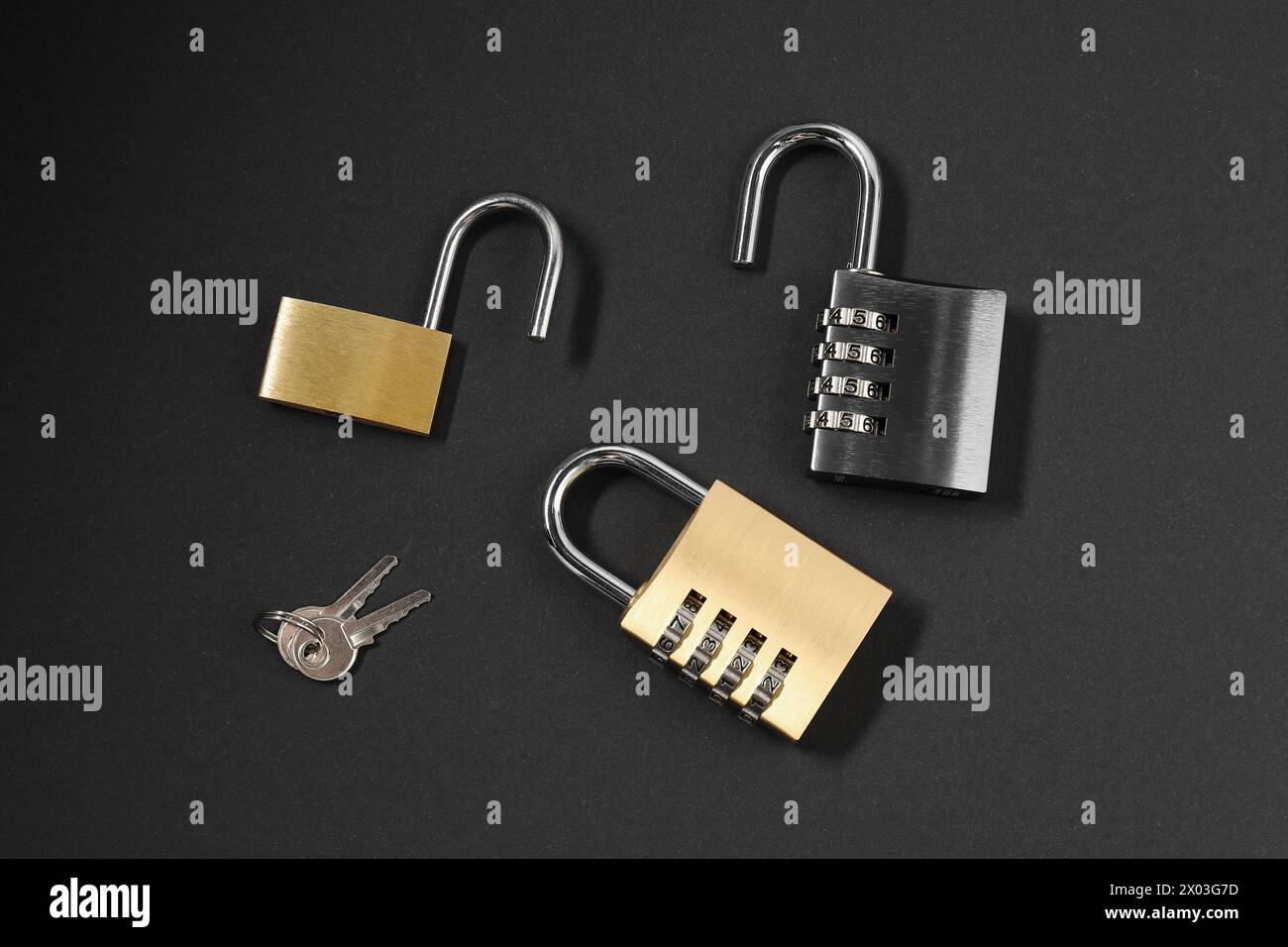 Different padlocks on black background, flat lay Stock Photo - Alamy