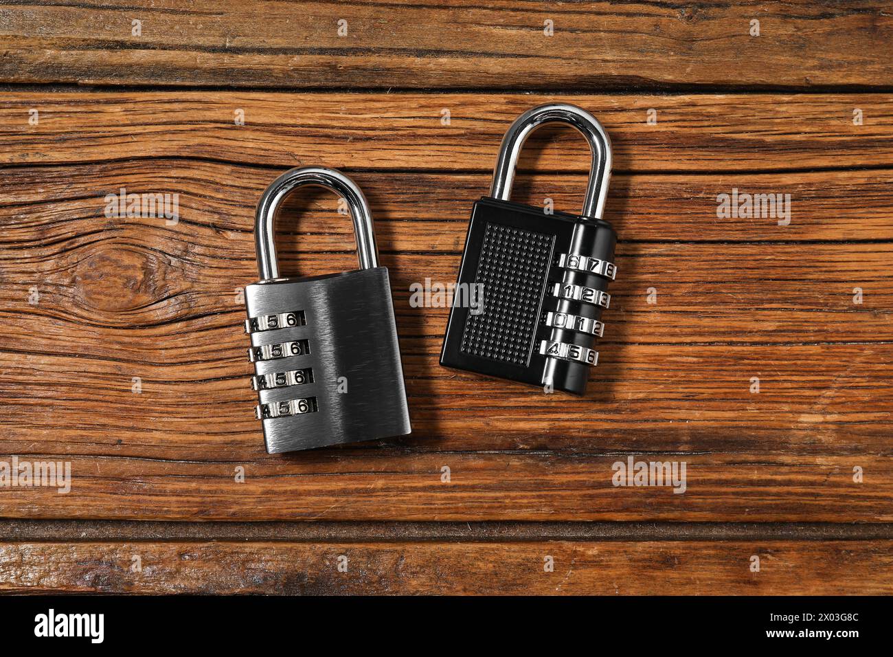 Steel combination padlocks on wooden table, top view Stock Photo - Alamy