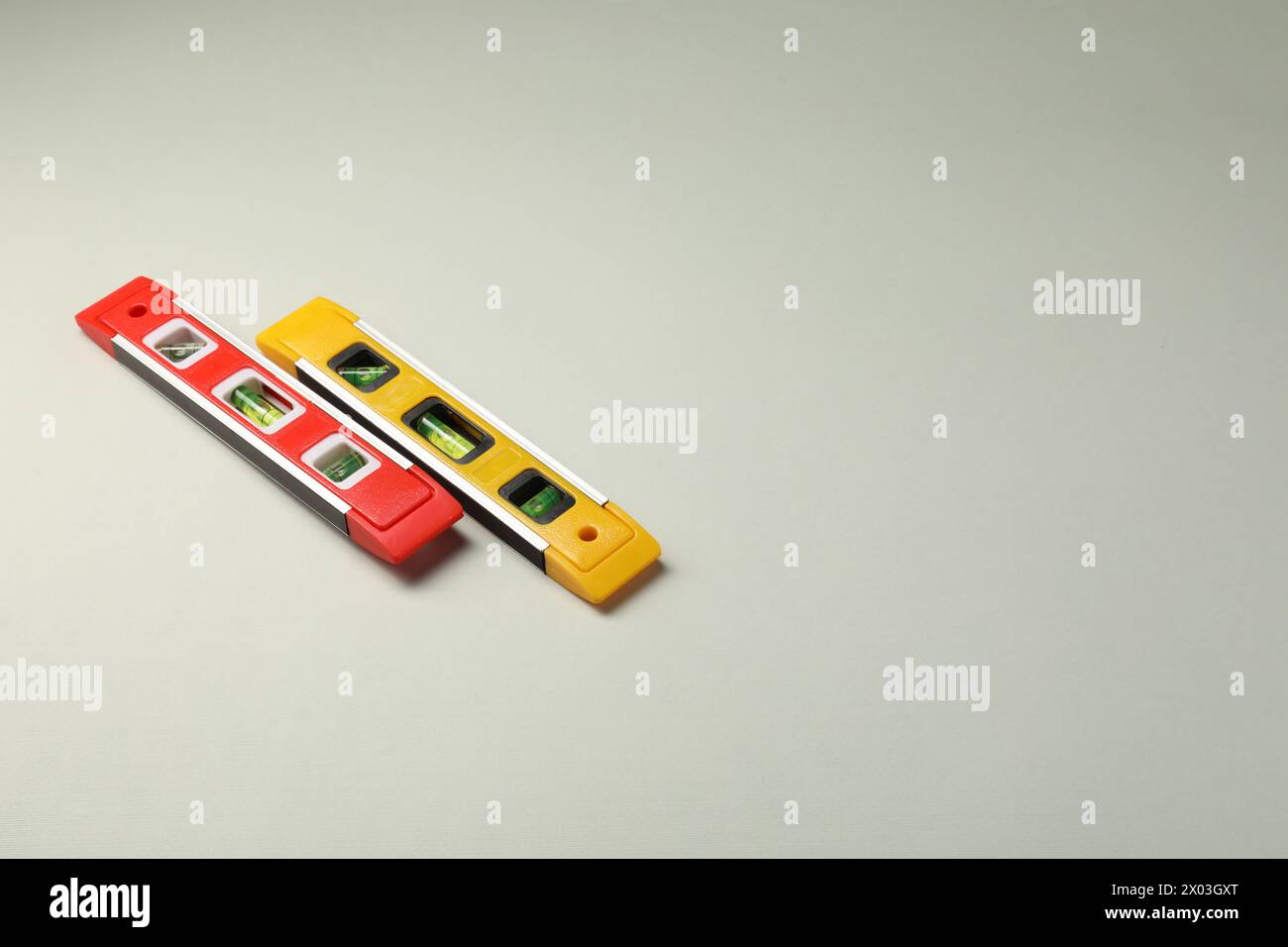 Building levels on beige background. Space for text Stock Photo - Alamy