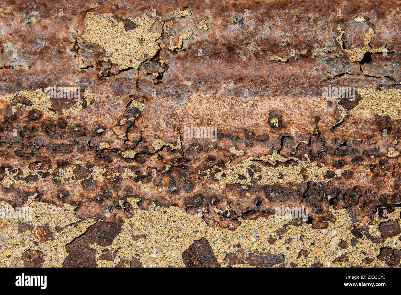 Crumbling and heavily rusted iron roof panel, rotting in theabandoned ...