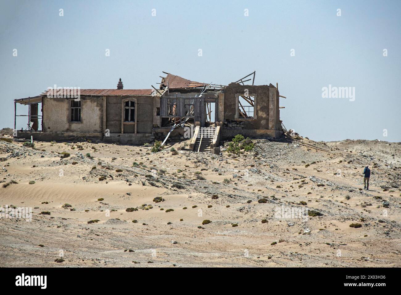 Person walking up the hill to explore the abandoned, Bogenfels mine ...