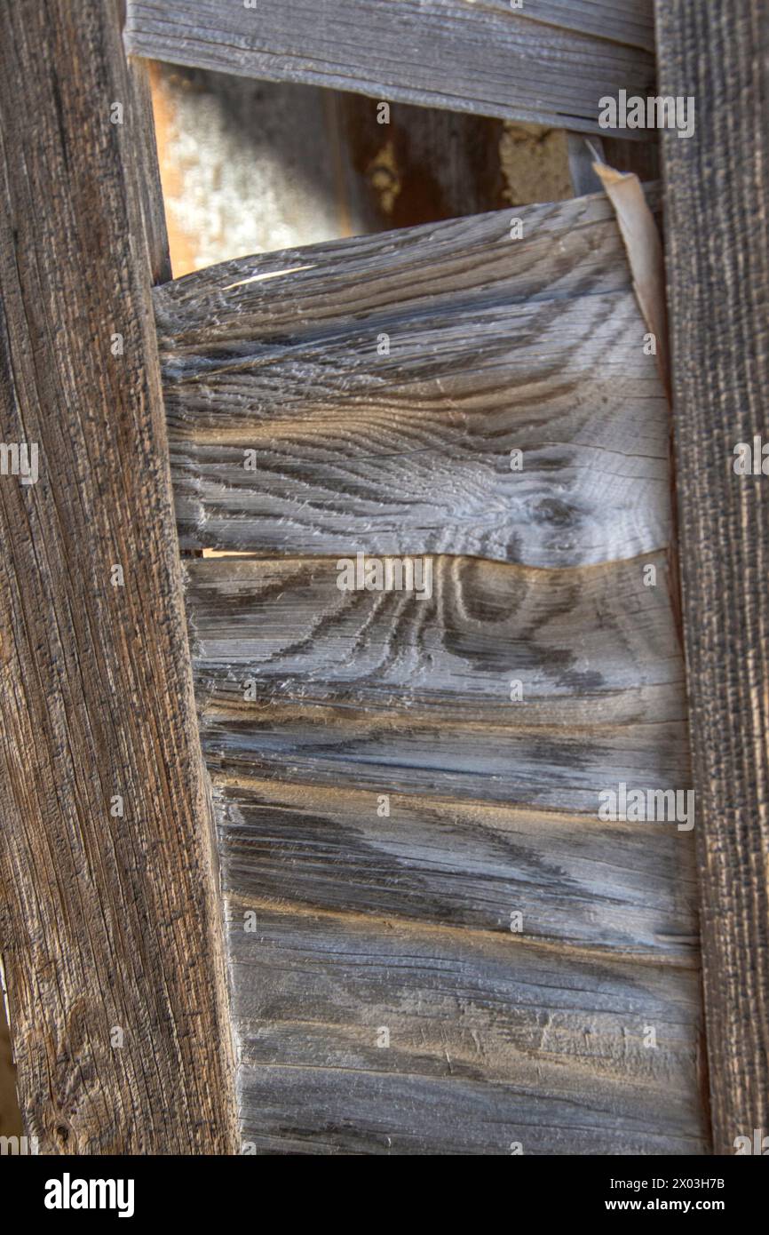 The remaining slats of a shutter on abandoned, miner's house, preserved ...