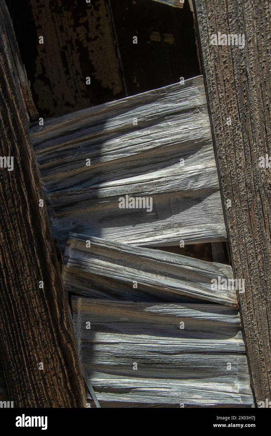 The remaining slats of a shutter on abandoned, miner's house, preserved ...