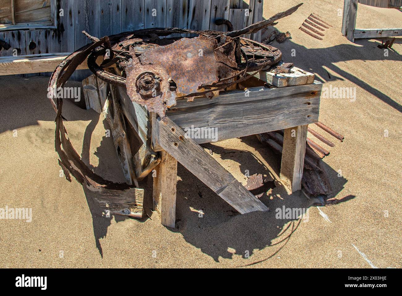Rusting ironwork on the workbench outside an abandoned miner's house in ...