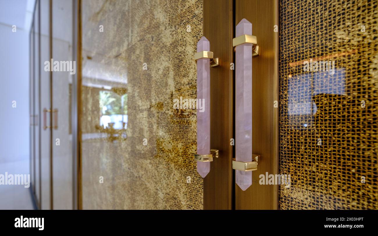 HAMALA, BAHRAIN - MARCH 02, 2019: Pink onyx handles adorn a set of ...