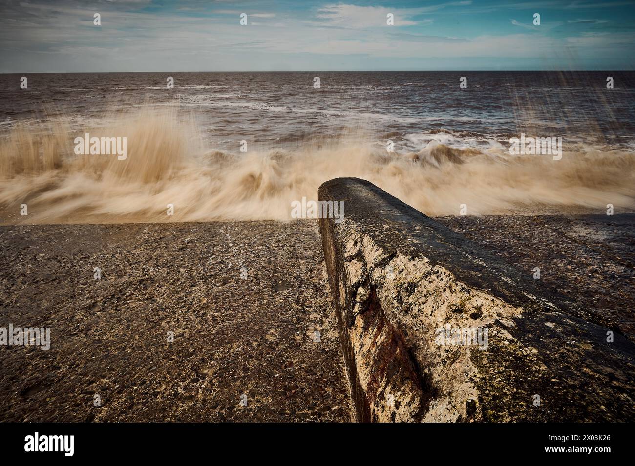 Damage to seawall caused by constant battering by the sea on the ...