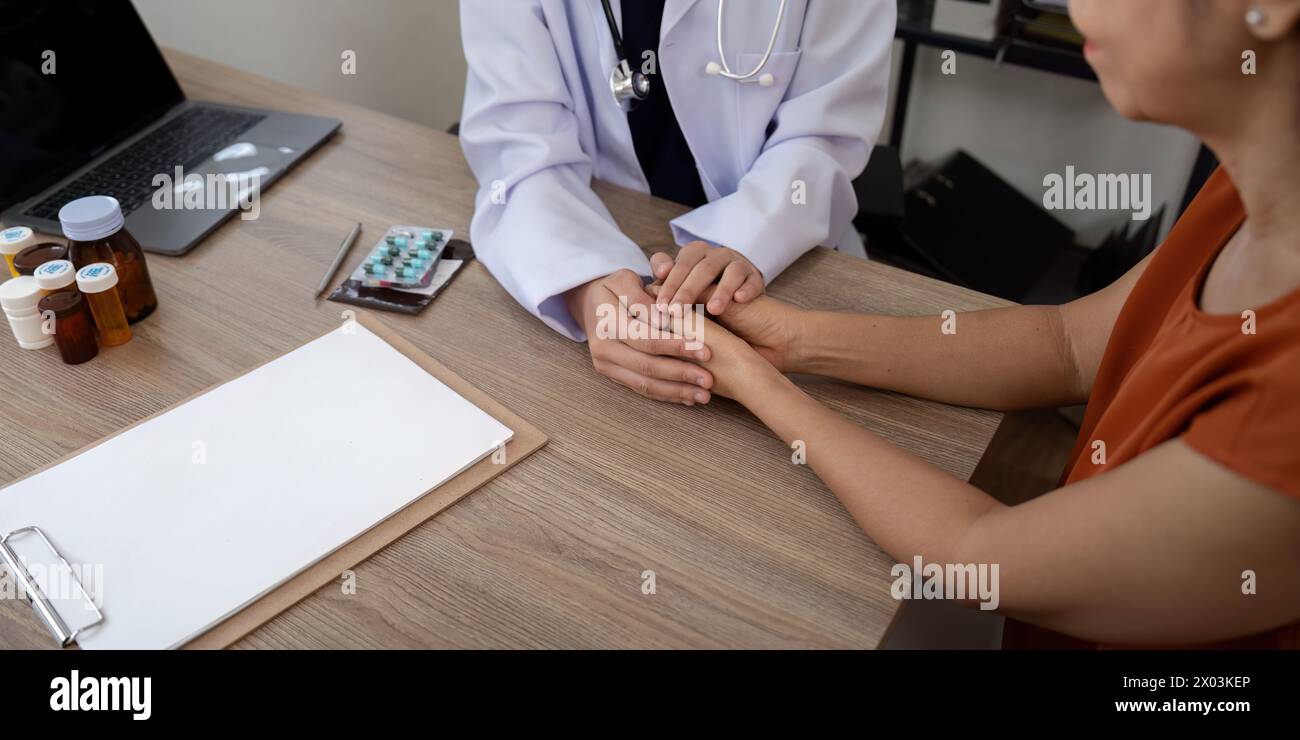 Doctor holding patient hand cheer and encourage while checking your ...