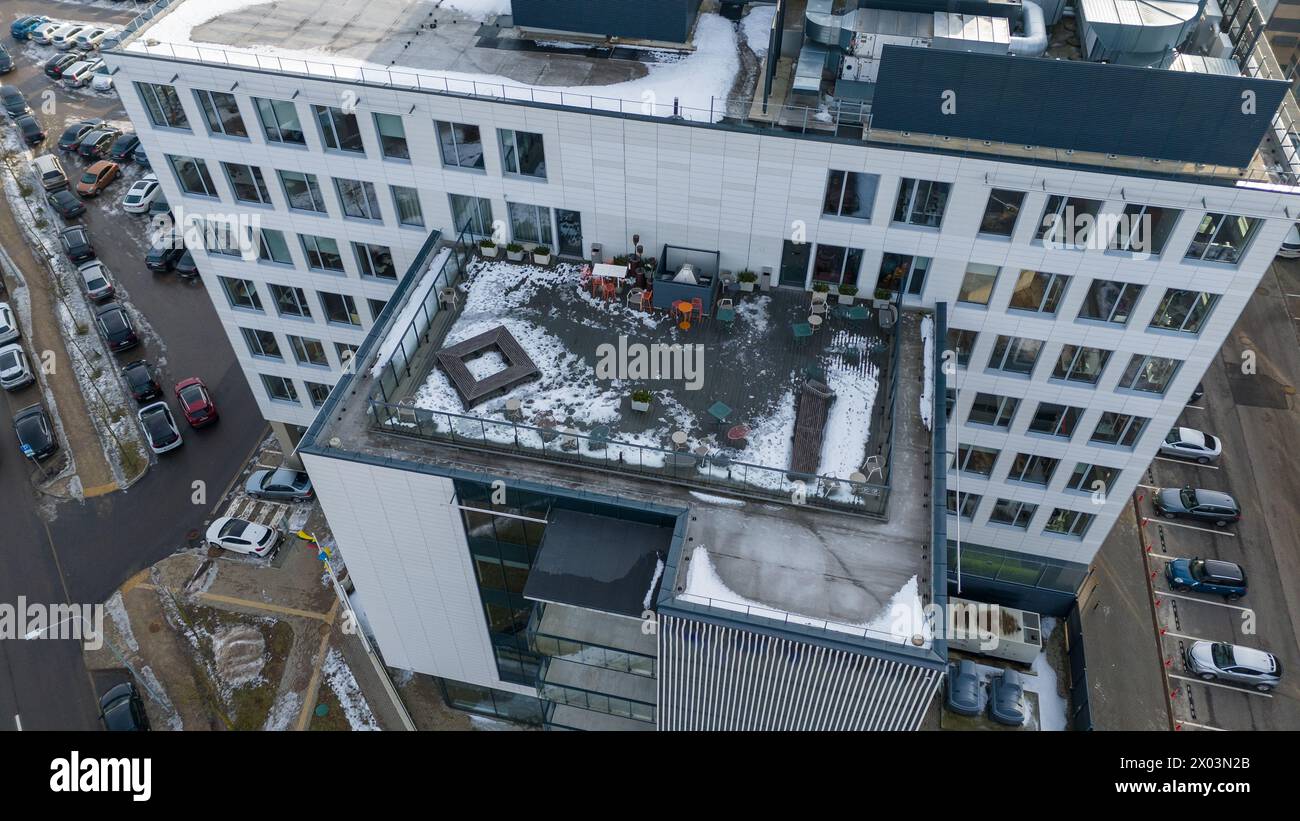 Drone photography of rooftop terrace in office building covered by snow ...