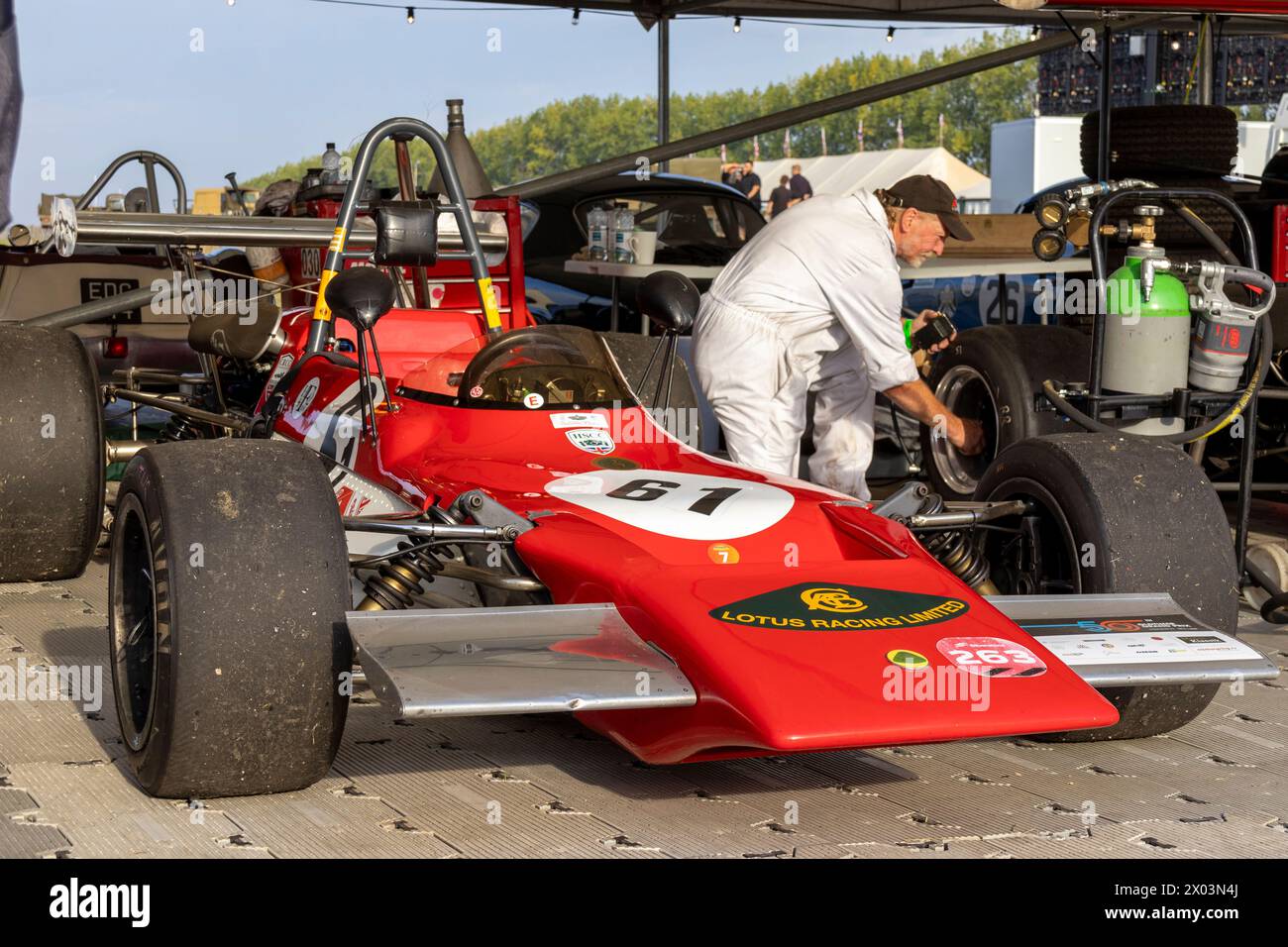 1969 Lotus 69 F2 racer in the paddock garage with mechanic. 75 Years of ...
