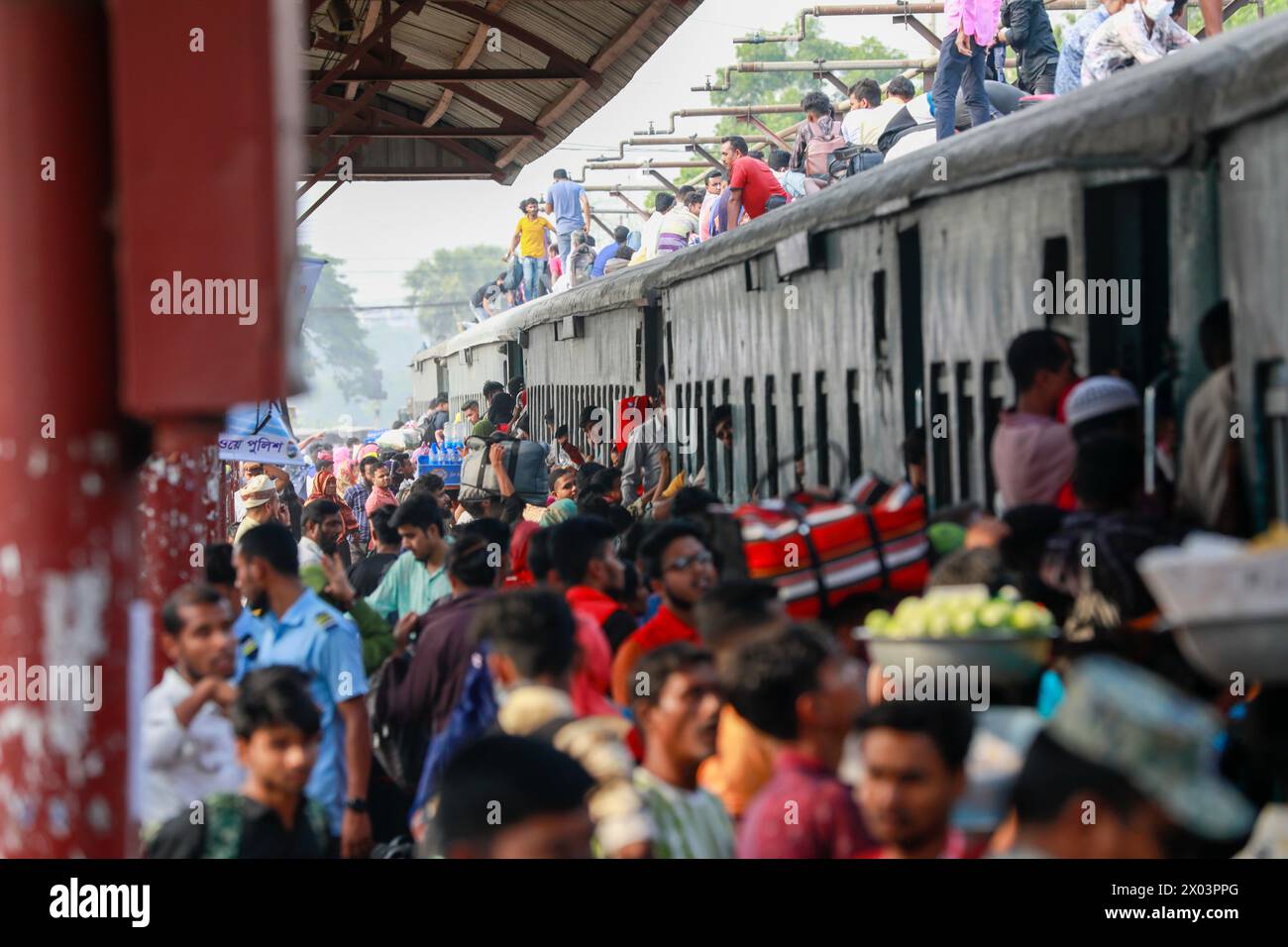 April 9, 2024, Gazipur, Bangladesh: Bangladeshi Muslim passengers try to get on board an ...
