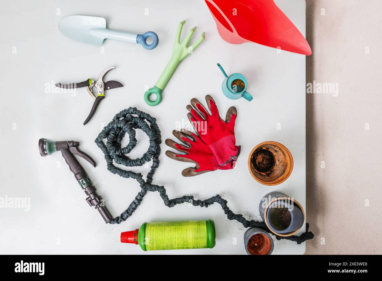 A smooth blue surface full of objects related to gardening Stock Photo ...