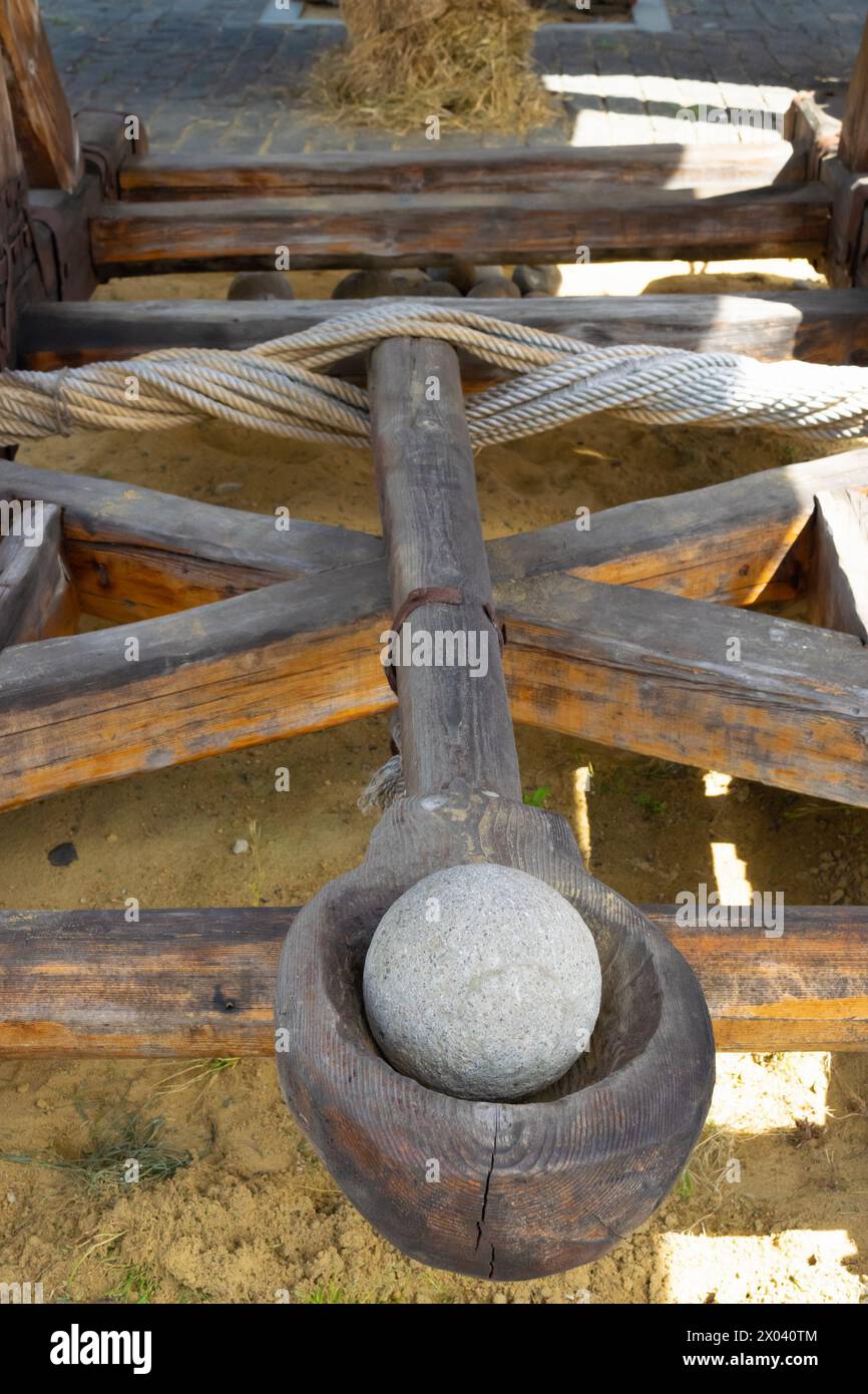 Wooden catapult in an open-air museum. An ancient weapon, a stone ...