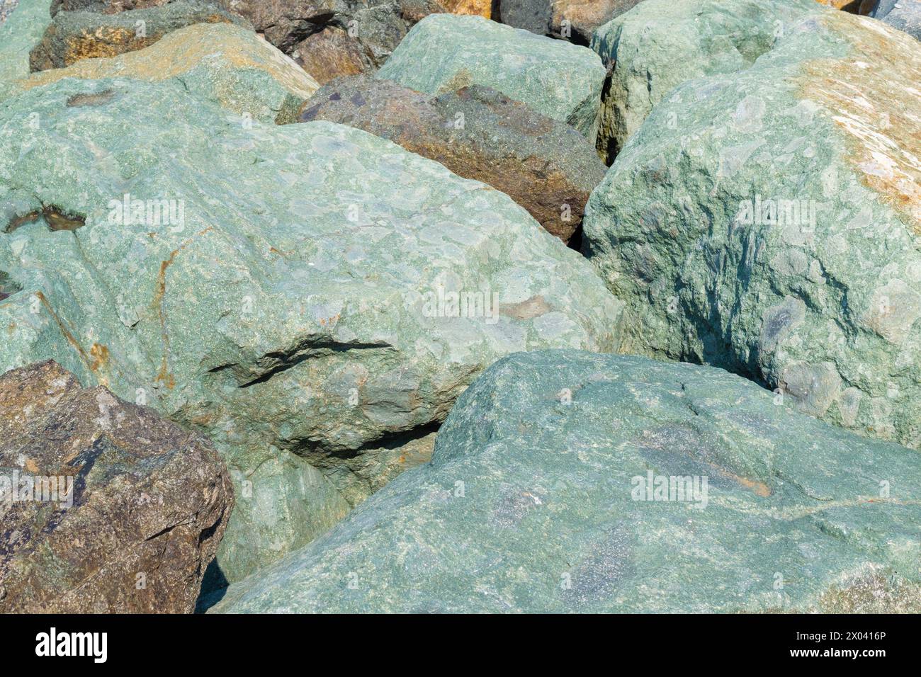Lots of big stones. Stone background. Strengthening the coastline ...