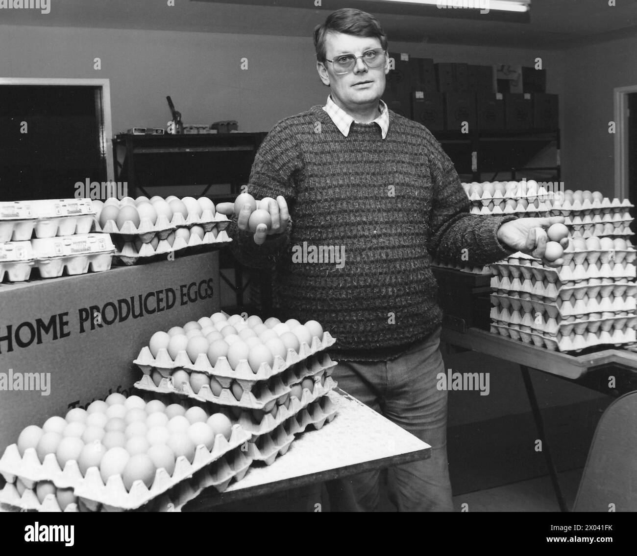FARMER EDWARD EDGELL WITH EGGS PRODUCED AT HIS BATTERY FARM, HAMPSHIRE ...