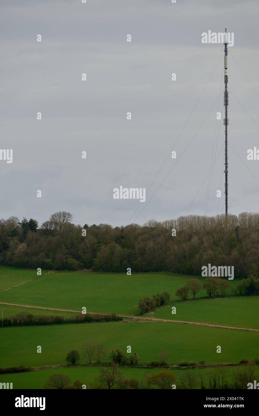 radio mast on top of hill ridge in english countryside on cloudy day ...