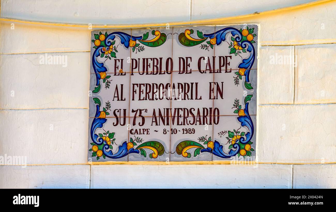 Tile sign with text honoring the 75th anniversary of its railroad ...