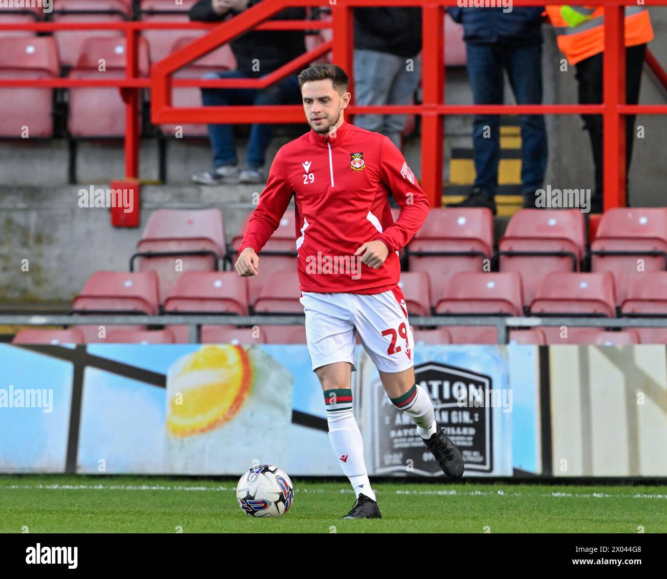 Wrexham, UK. 09th Apr, 2024. Ryan Barnett of Wrexham warms up ahead of ...