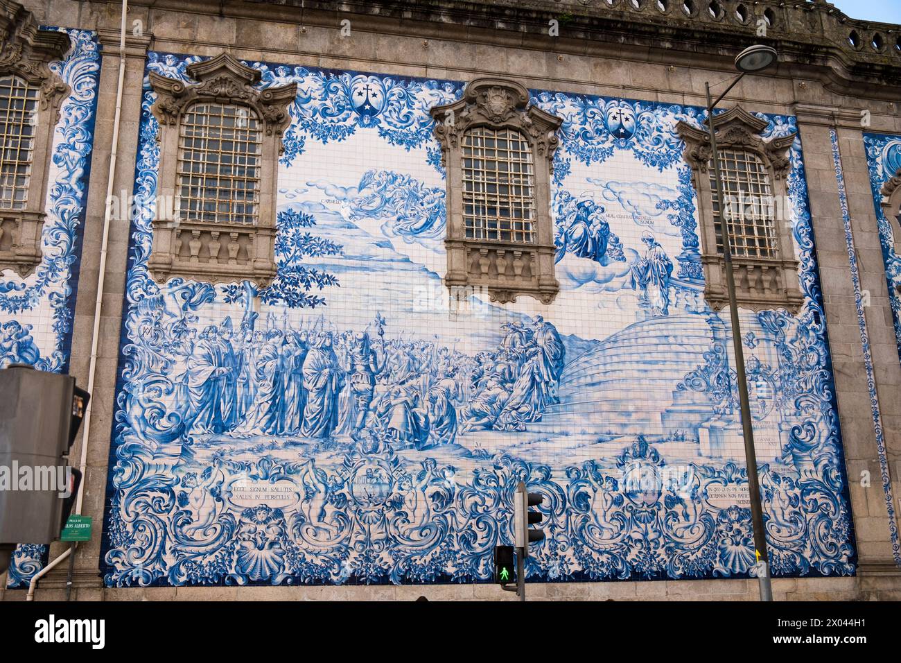 Traditional blue and white azulejos tilework adorn an old building ...