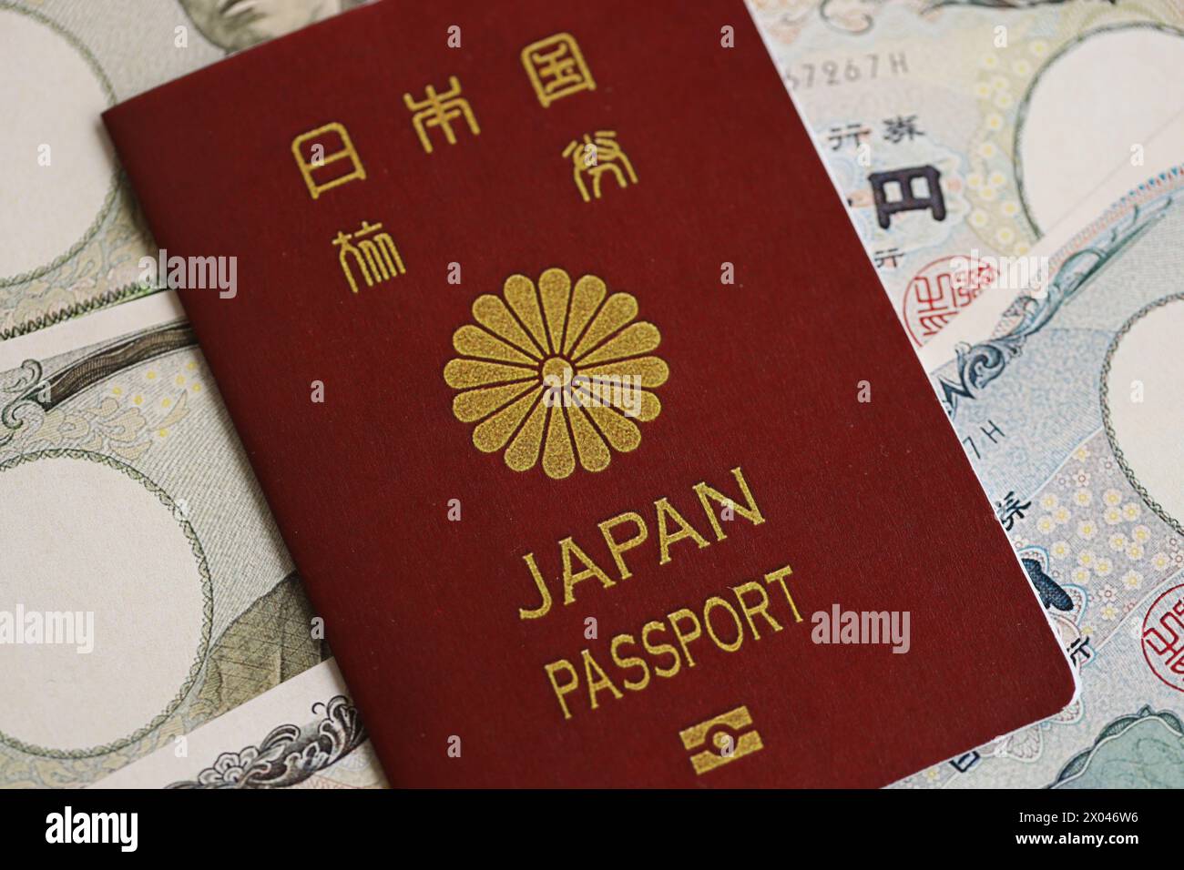 Japan passport with japanese yen money bills on table close up. Tourism ...