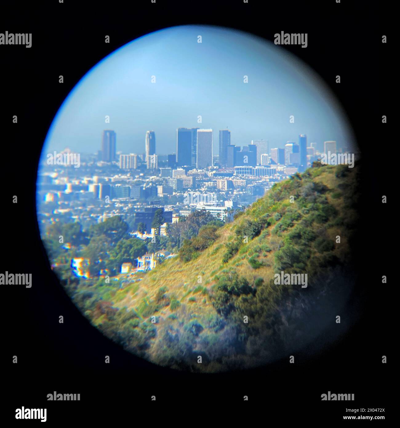The Los Angeles skyline seen through a spyglass or telescope ...