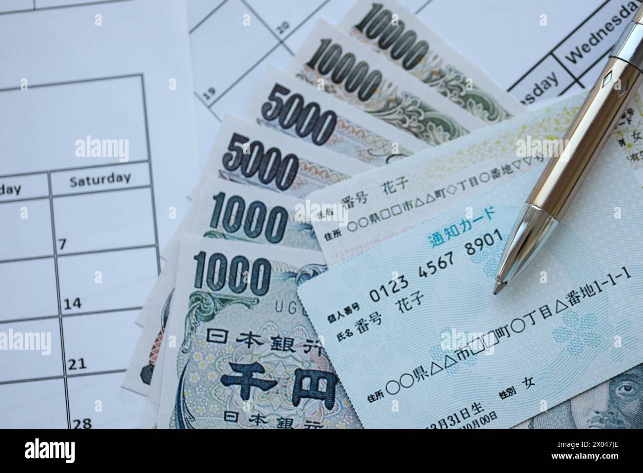 Japanese my number card specimen and notification card on calendar ...