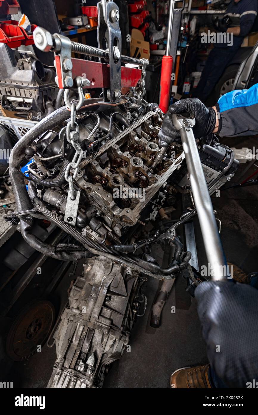 Experience auto expertise as the mechanic gloved hands skillfully ...