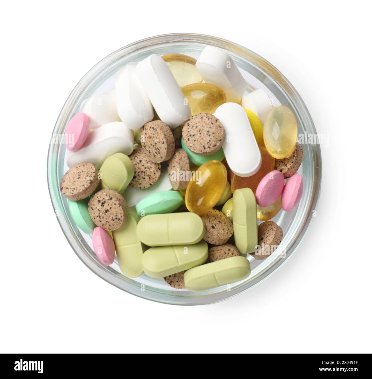Different vitamin capsules in bowl isolated on white, top view Stock ...
