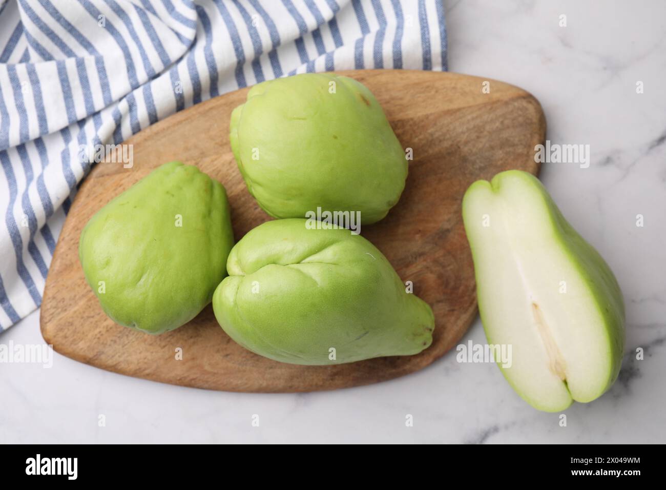 Fresh green chayote on light marble table, top view Stock Photo - Alamy