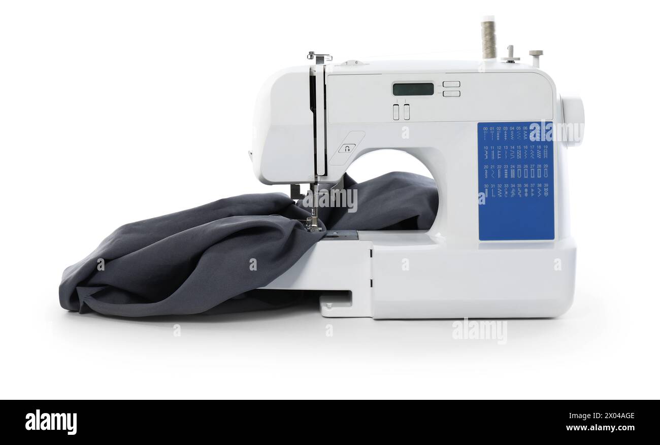 Sewing machine with grey fabric isolated on white Stock Photo - Alamy