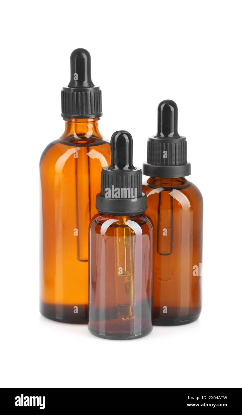 Glass bottles of tincture isolated on white Stock Photo - Alamy