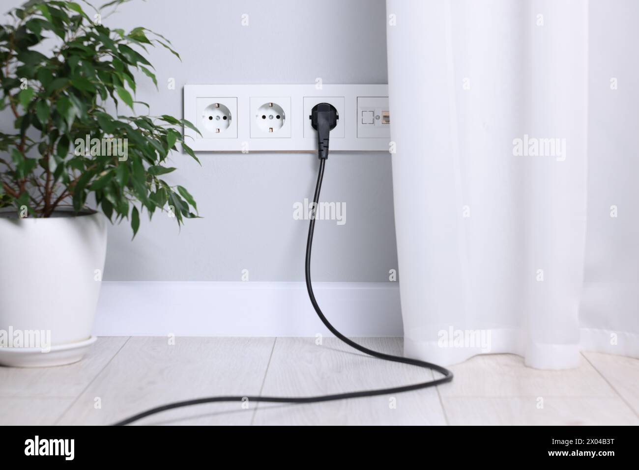 Power cable plugged wall hi-res stock photography and images - Alamy