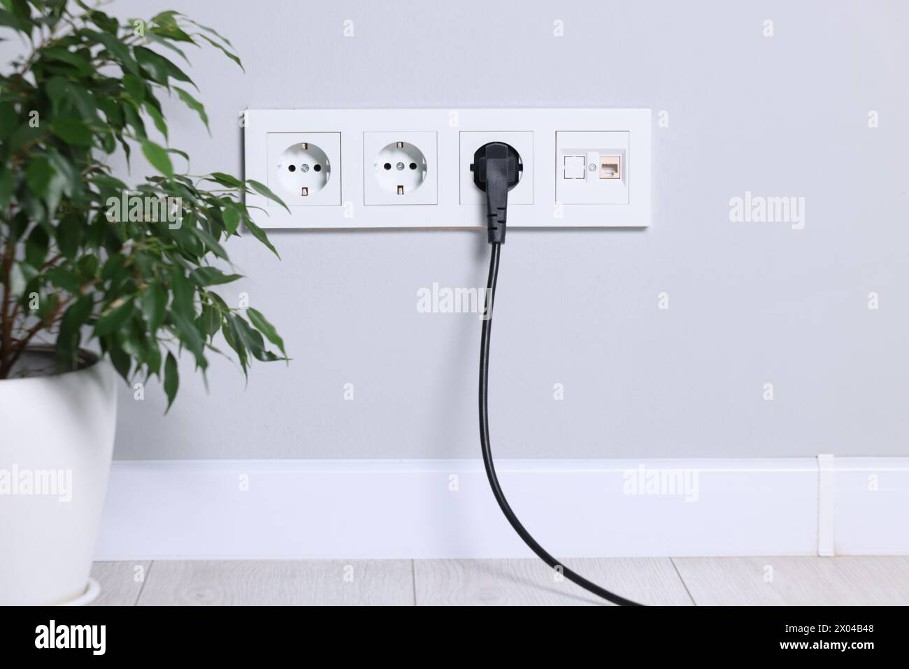 Power cable plugged wall hi-res stock photography and images - Alamy
